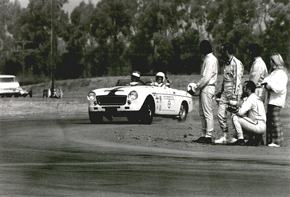 Bob Bondurant Monitors A Pupil From Trackside bob-bondurant-monitors-a-pupil-from-trackside